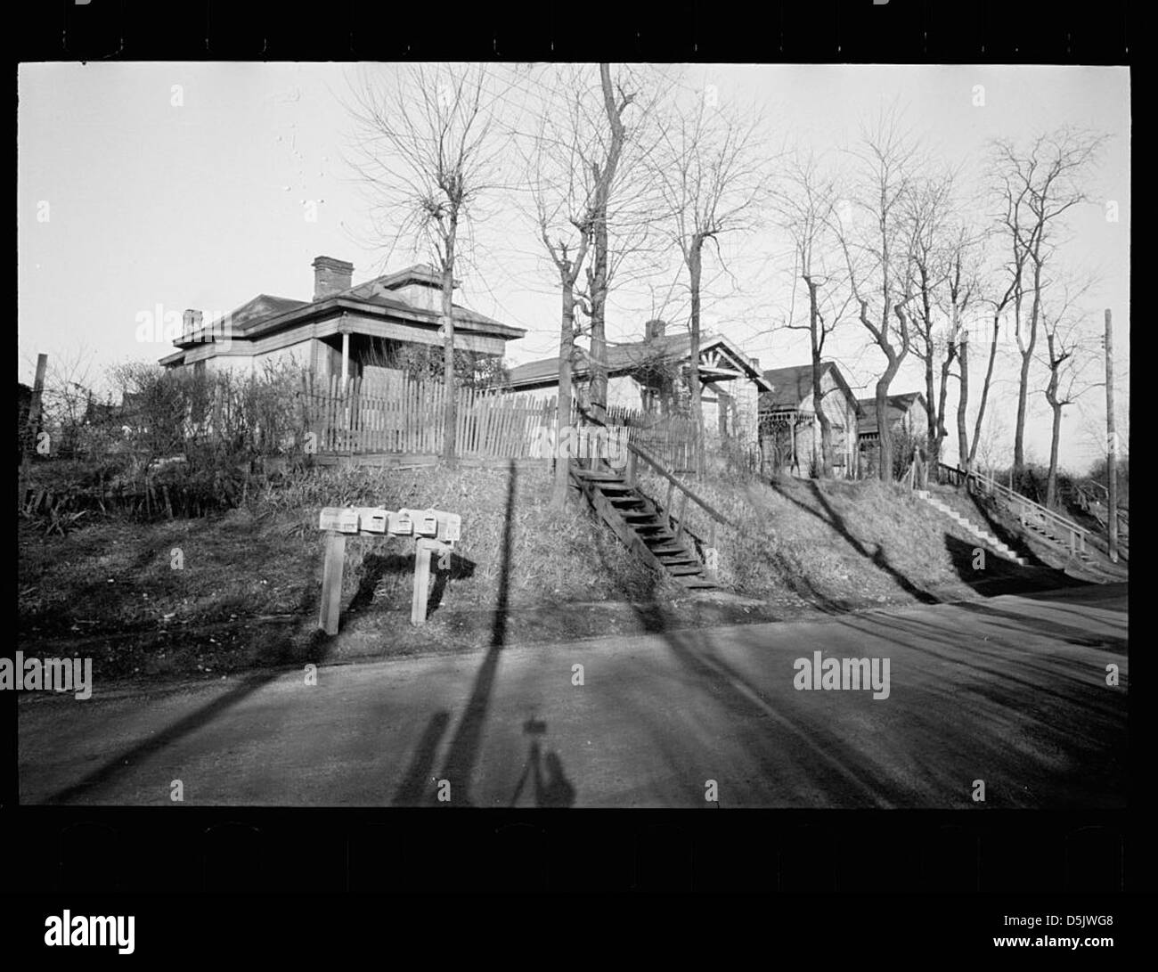This photograph depicts poorly constructed houses in Lockland, Ohio, in ...