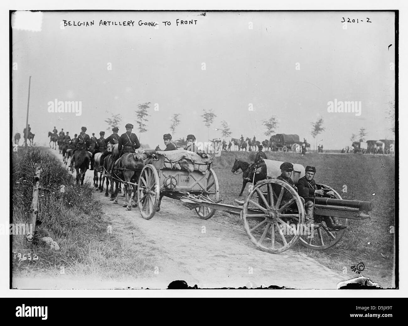 This image shows Belgian artillerymen moving to the front lines during ...