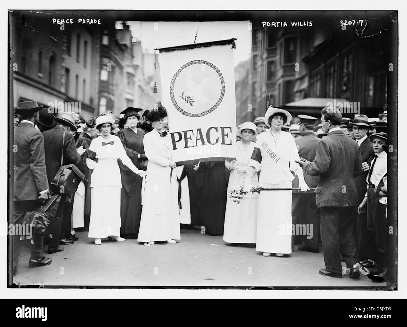 This image captures a peace parade in 1914, featuring Portia Willis ...