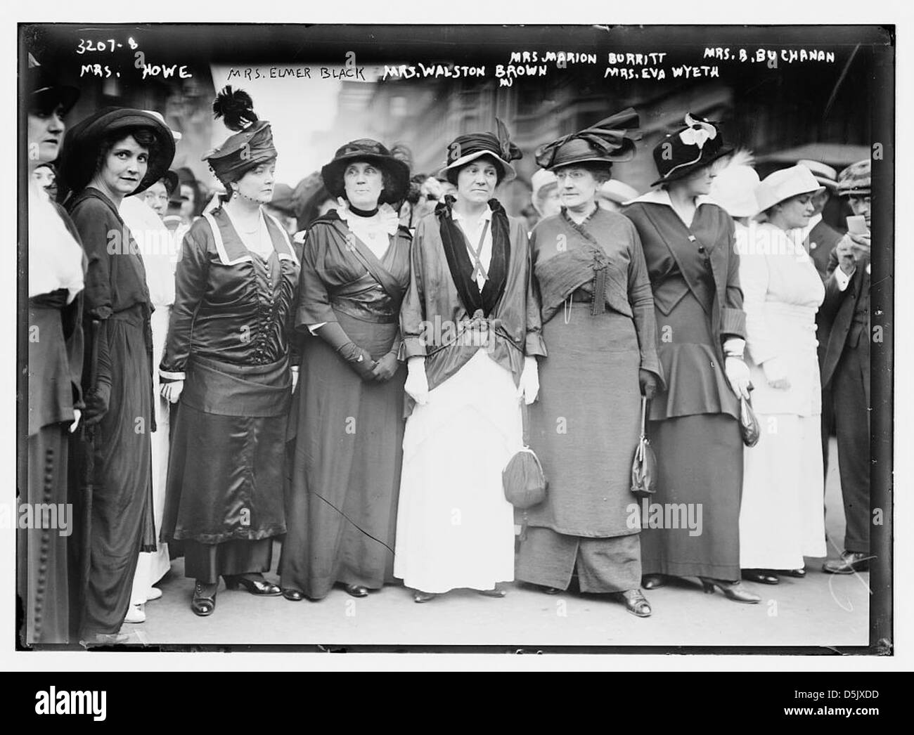 A photograph from a 1914 peace parade showing several women, including ...
