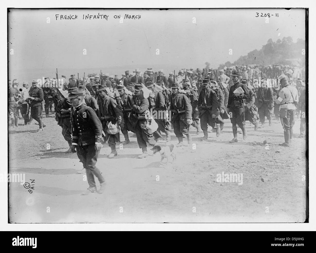 This historical photograph shows French infantry soldiers marching, a ...