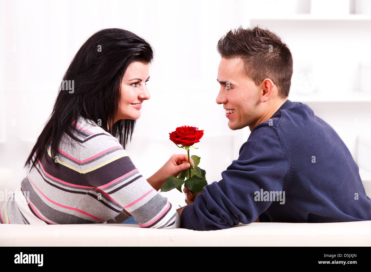Romantic Young Couple Holding Rose High Resolution Stock Photography ...