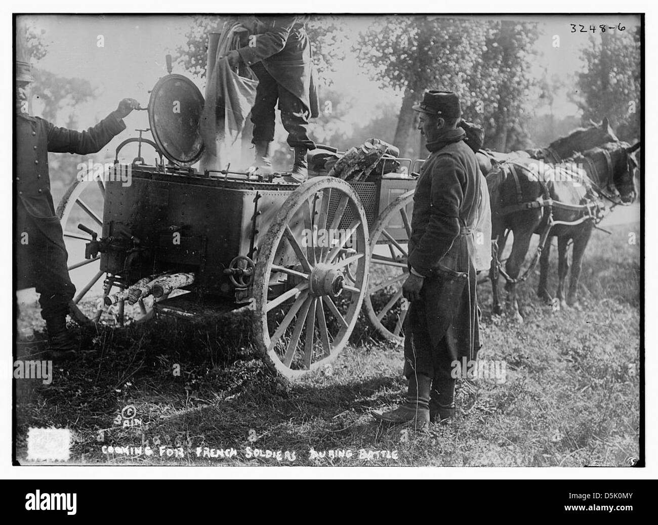 This photo depicts a French Army field kitchen preparing food for ...