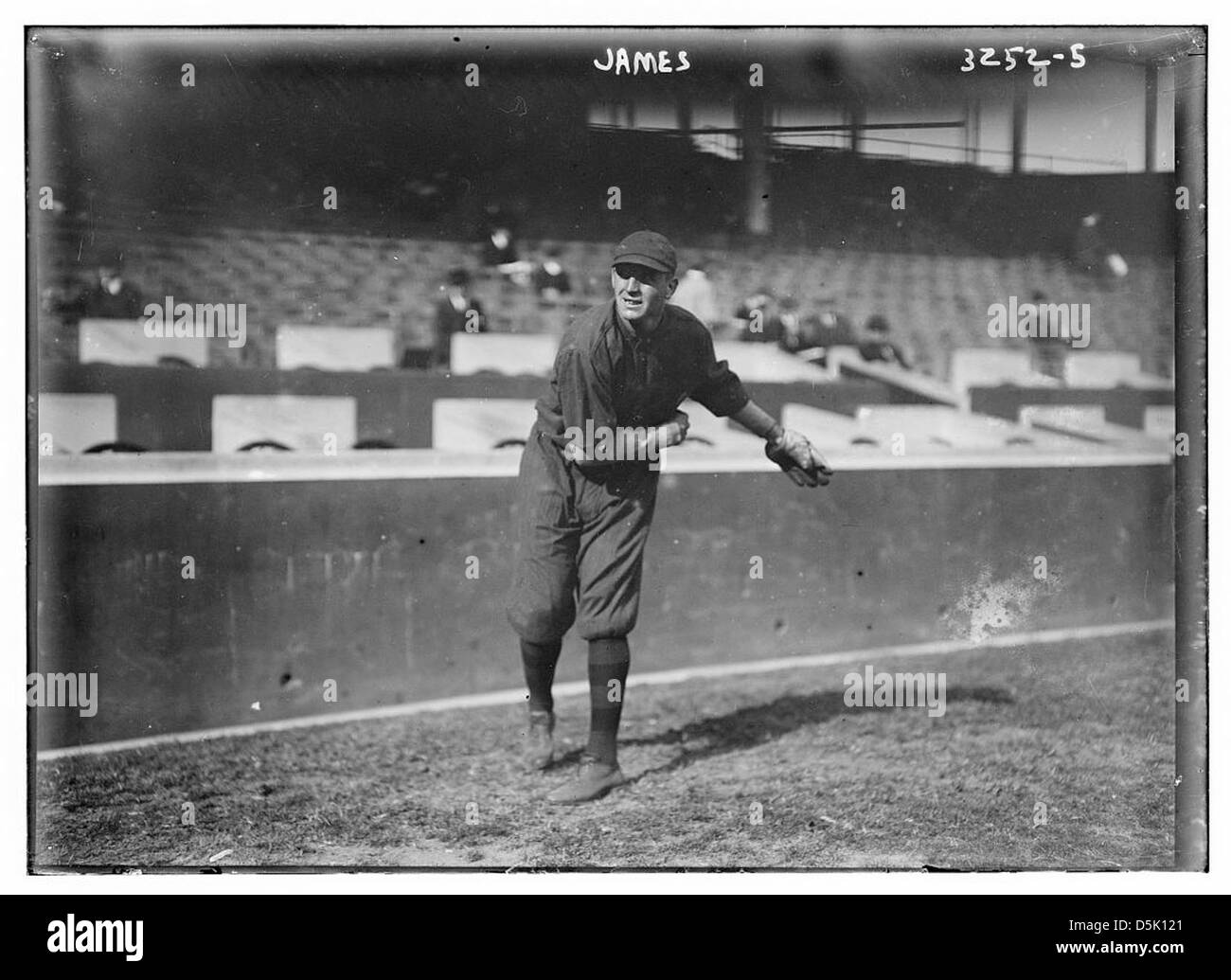 Bill L. James, a pitcher for the Boston Braves, is captured throwing a ...