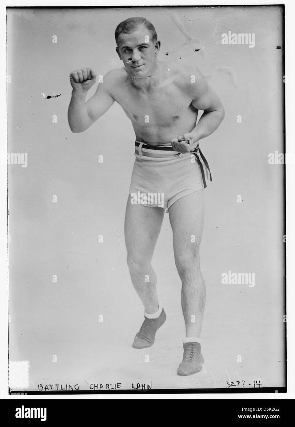 The photograph captures Charles Battling Charlie Lohn, a boxer known ...