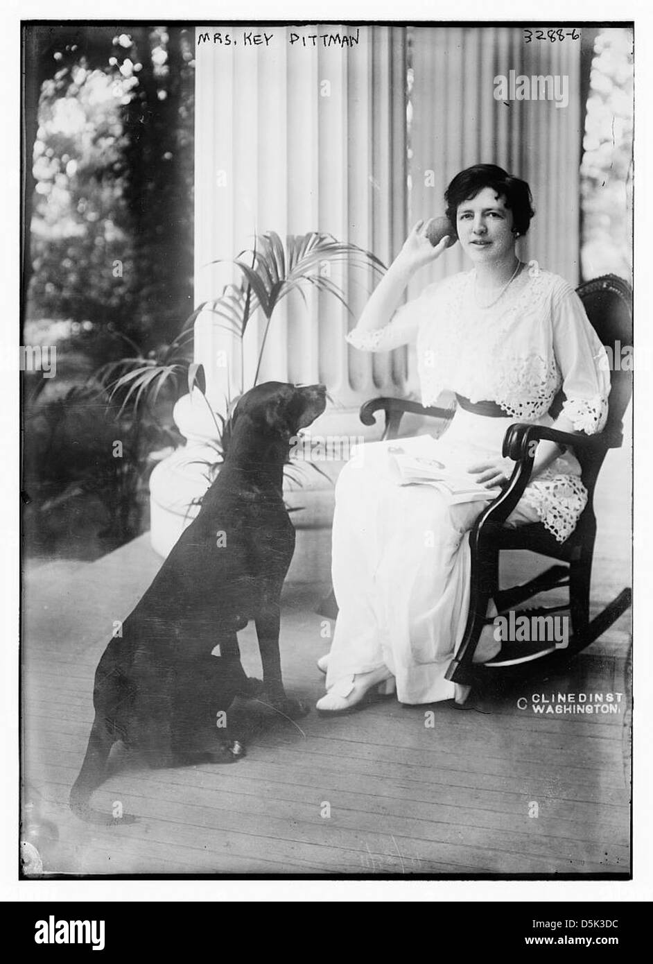 This image shows Mrs. Key Pittman outdoors at a country home ...