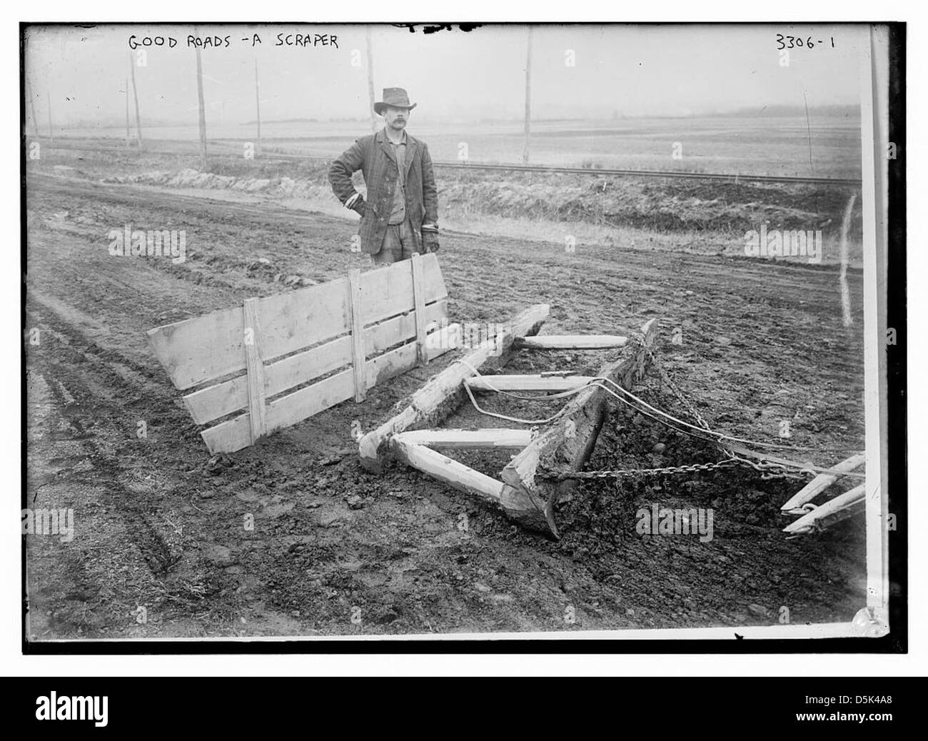 The image depicts a road grader, part of the Good Roads movement, used ...