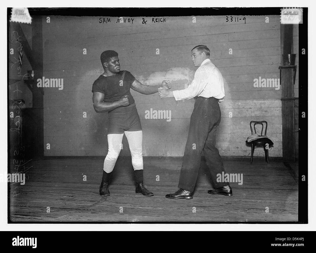 A photograph featuring boxers Sam McVey and Al Reich, likely taken in ...