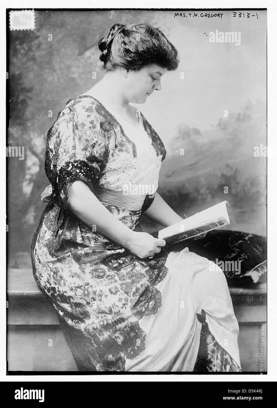 A portrait of Mrs. T.W. Gregory, captured in a seated position while ...
