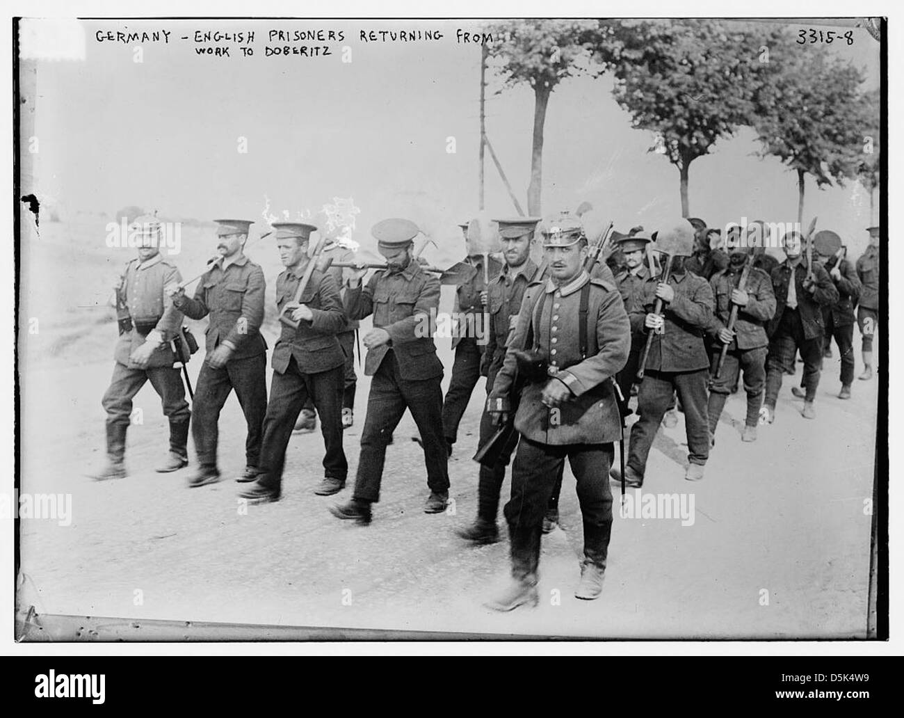 A photograph showing British prisoners of war returning from work to ...