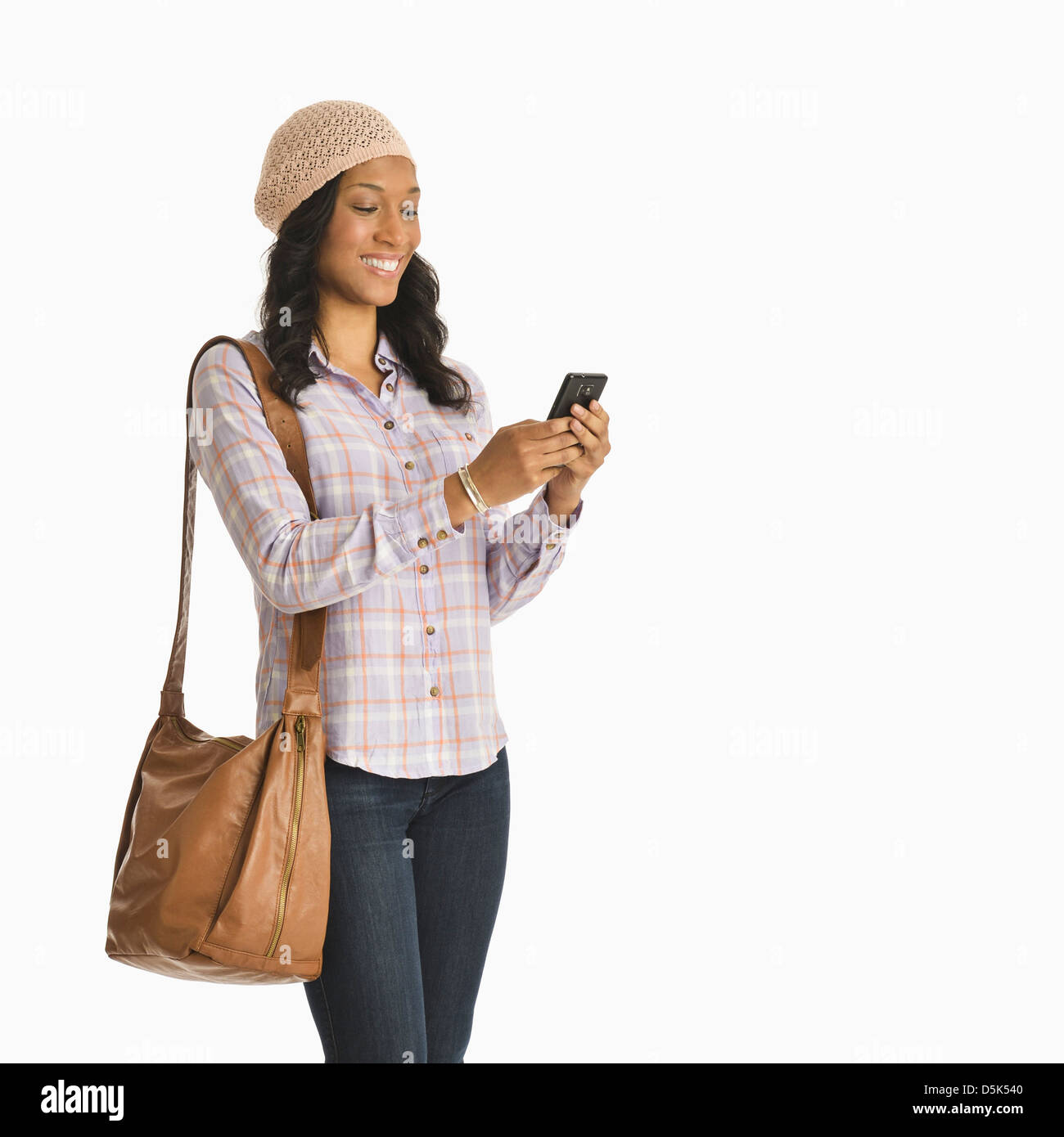 Mid adult woman using phone Stock Photo - Alamy