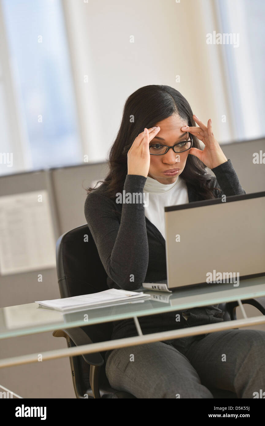 Stressed female office worker hi-res stock photography and images - Alamy