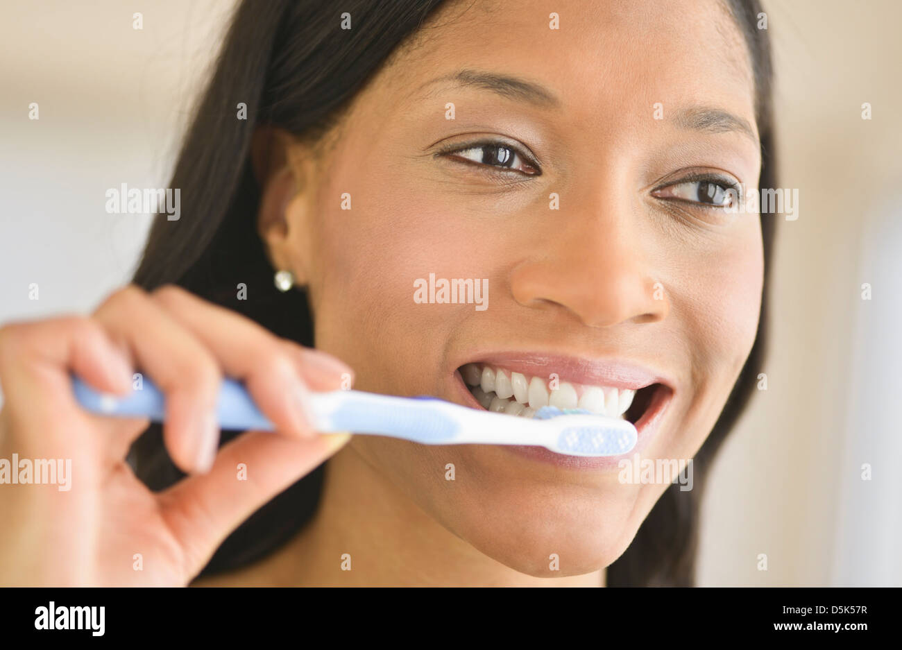 Woman brushing teeth Stock Photo - Alamy