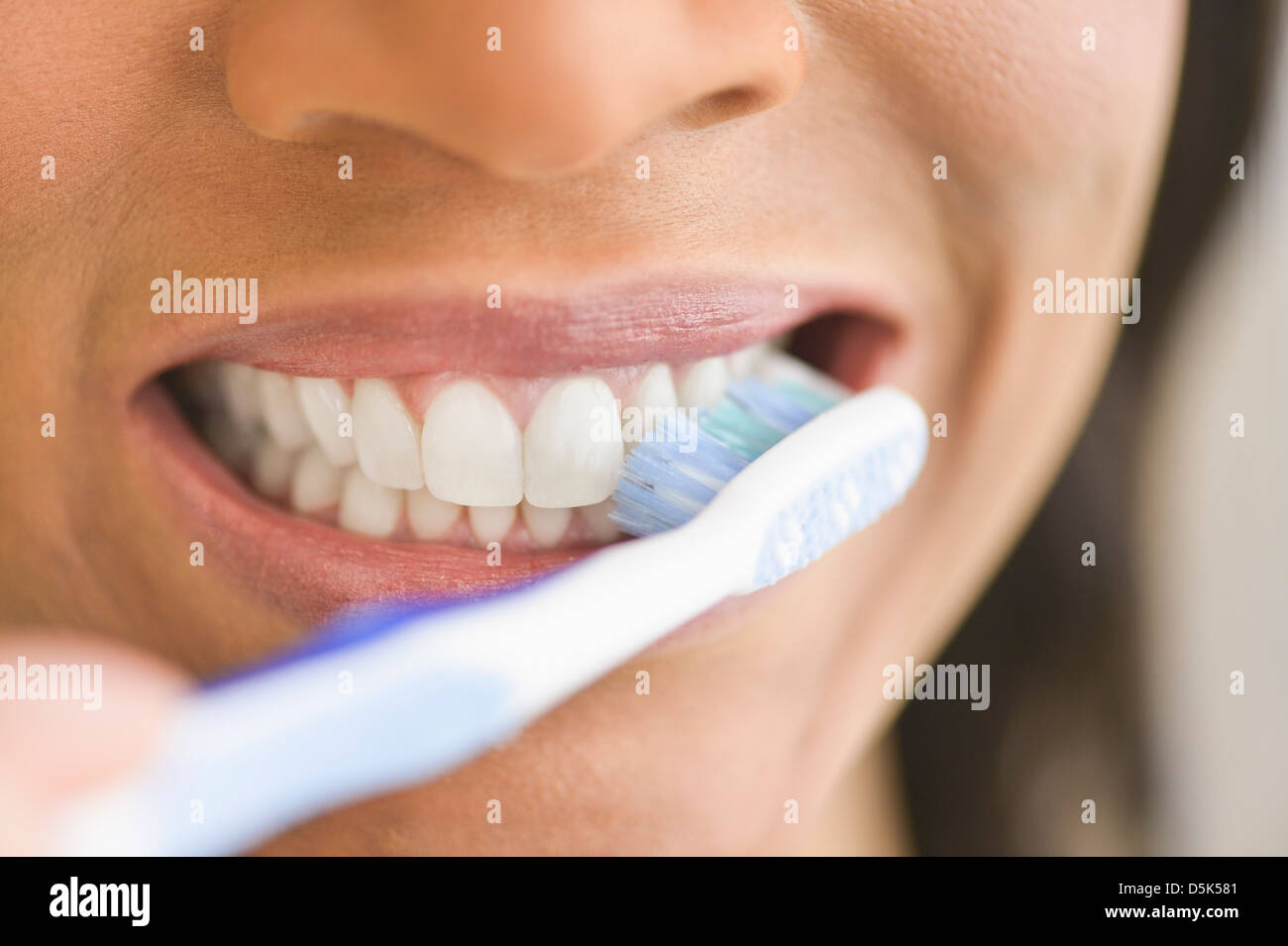 Close-up of woman brushing teeth Stock Photo - Alamy