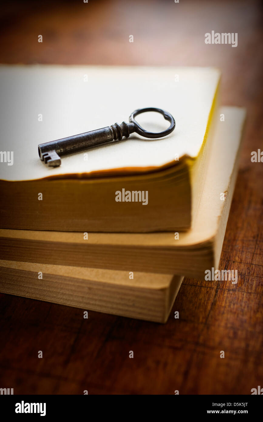 Antique book and key Stock Photo - Alamy