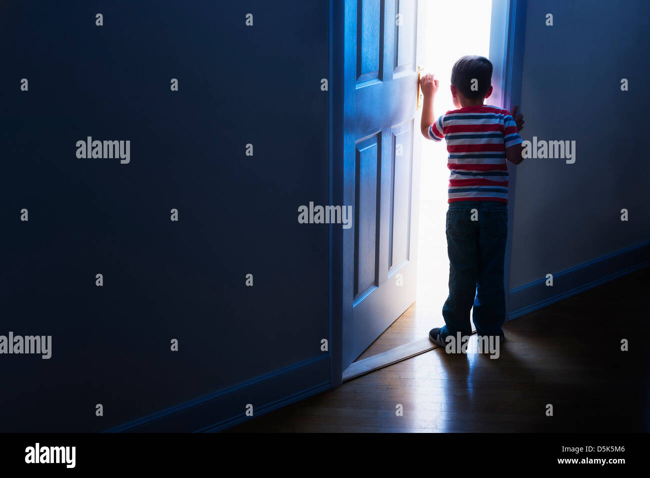 Peeking through door night hi-res stock photography and images - Alamy