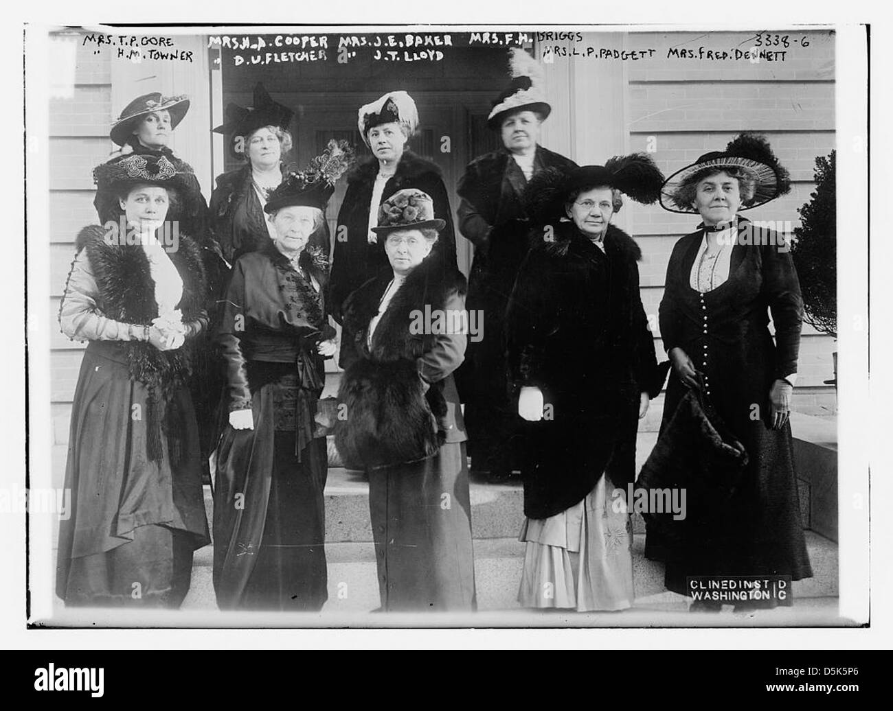 This image shows a group of women posed for a portrait outdoors in ...