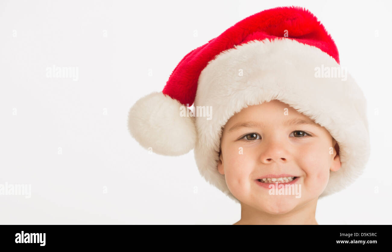 Portrait of boy (4-5) wearing santa hat Stock Photo - Alamy