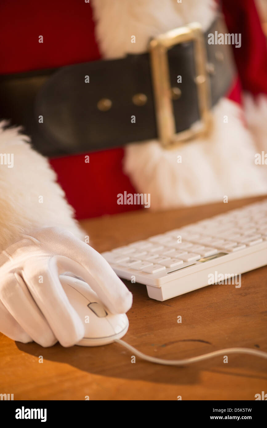 Close-up of santa claus using computer Stock Photo - Alamy