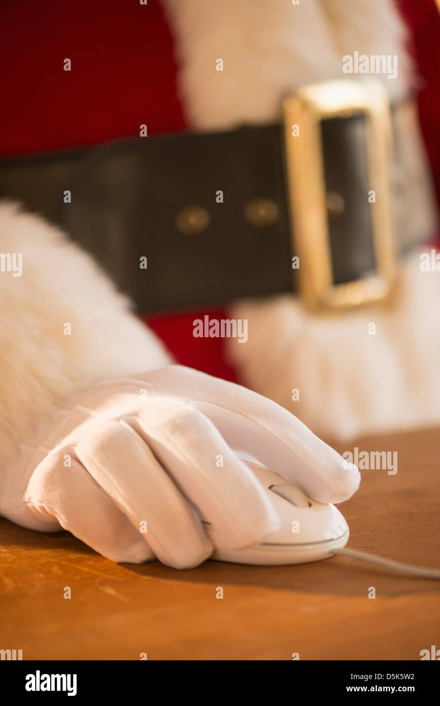 Close-up of santa claus using computer Stock Photo - Alamy