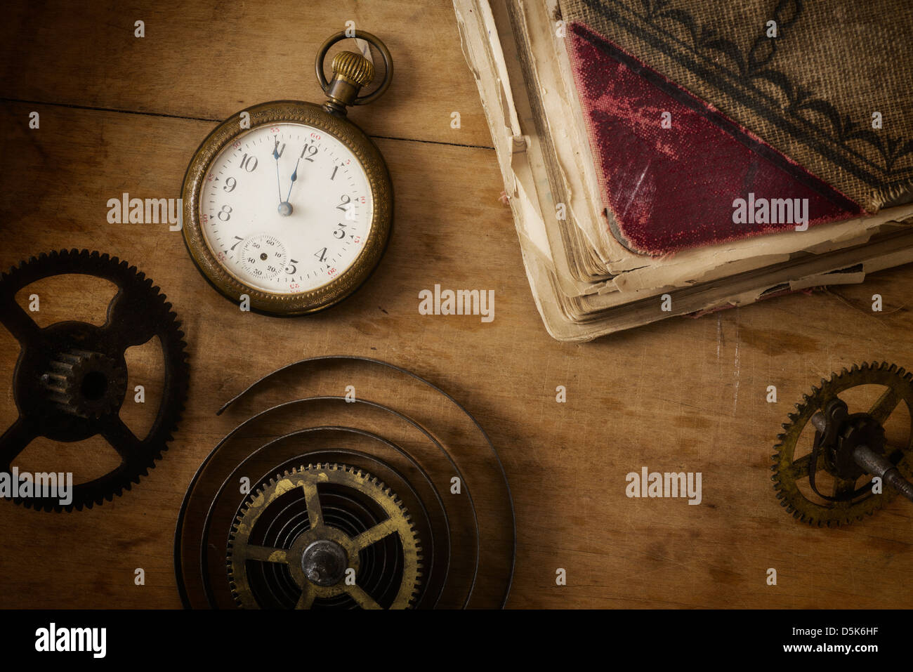 Still life with pocket watch and gears Stock Photo - Alamy