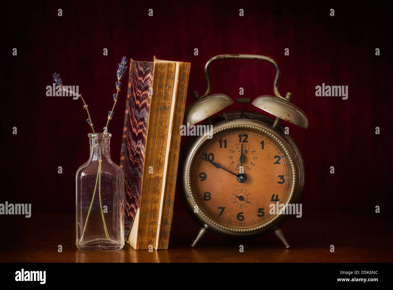 Still life with antique clock and books Stock Photo - Alamy