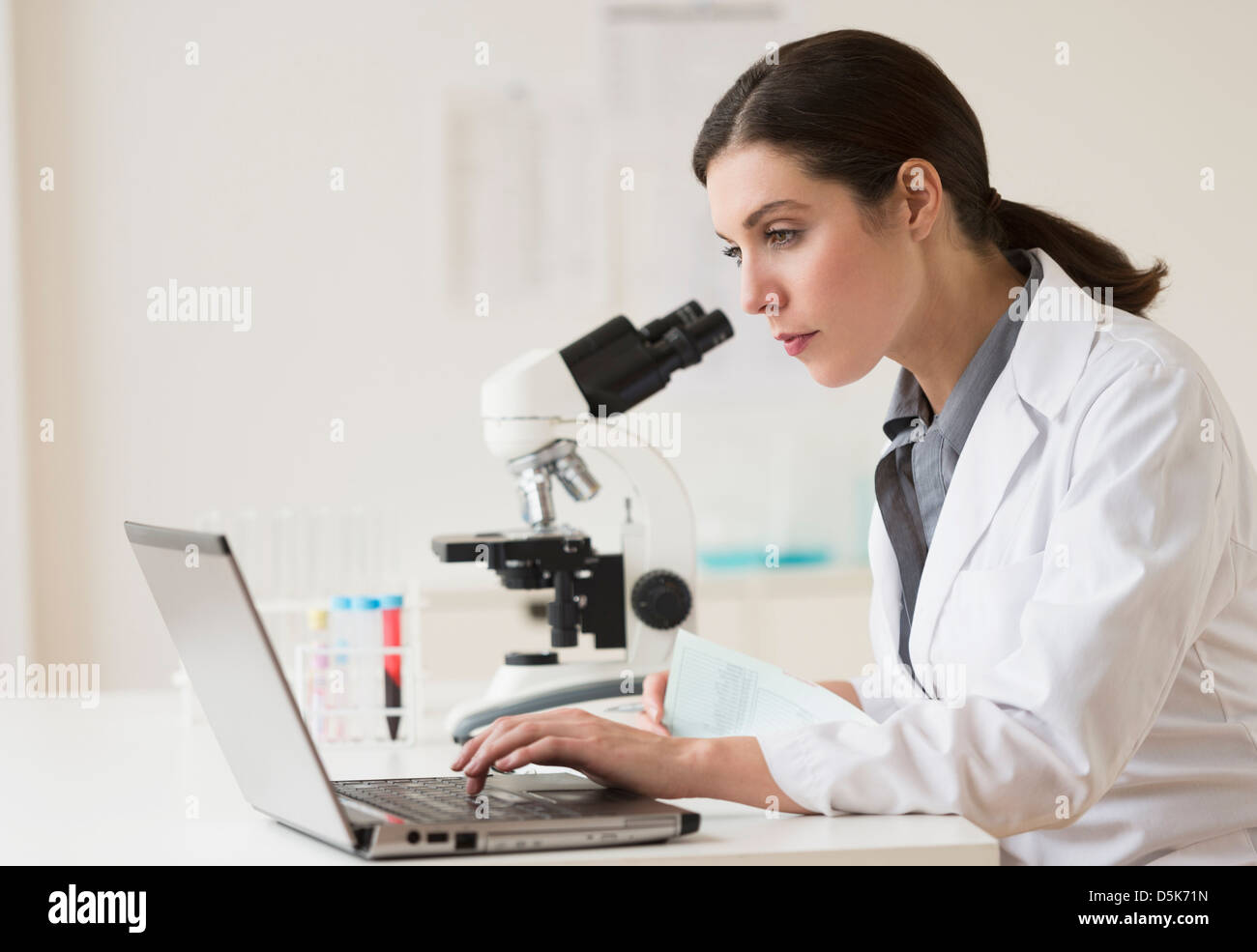 Woman scientist research laptop hi-res stock photography and images - Alamy