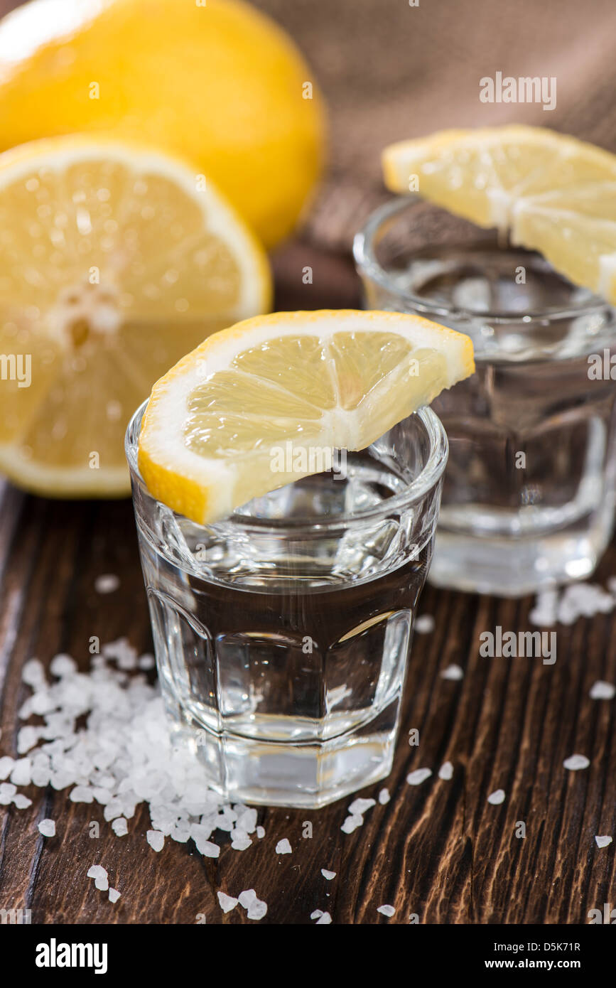 Two Shots (Tequila) on vintage wooden background Stock Photo - Alamy