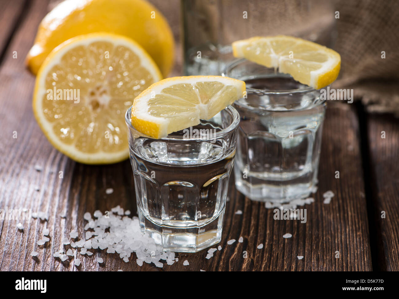 Two Shots (Tequila) on vintage wooden background Stock Photo - Alamy