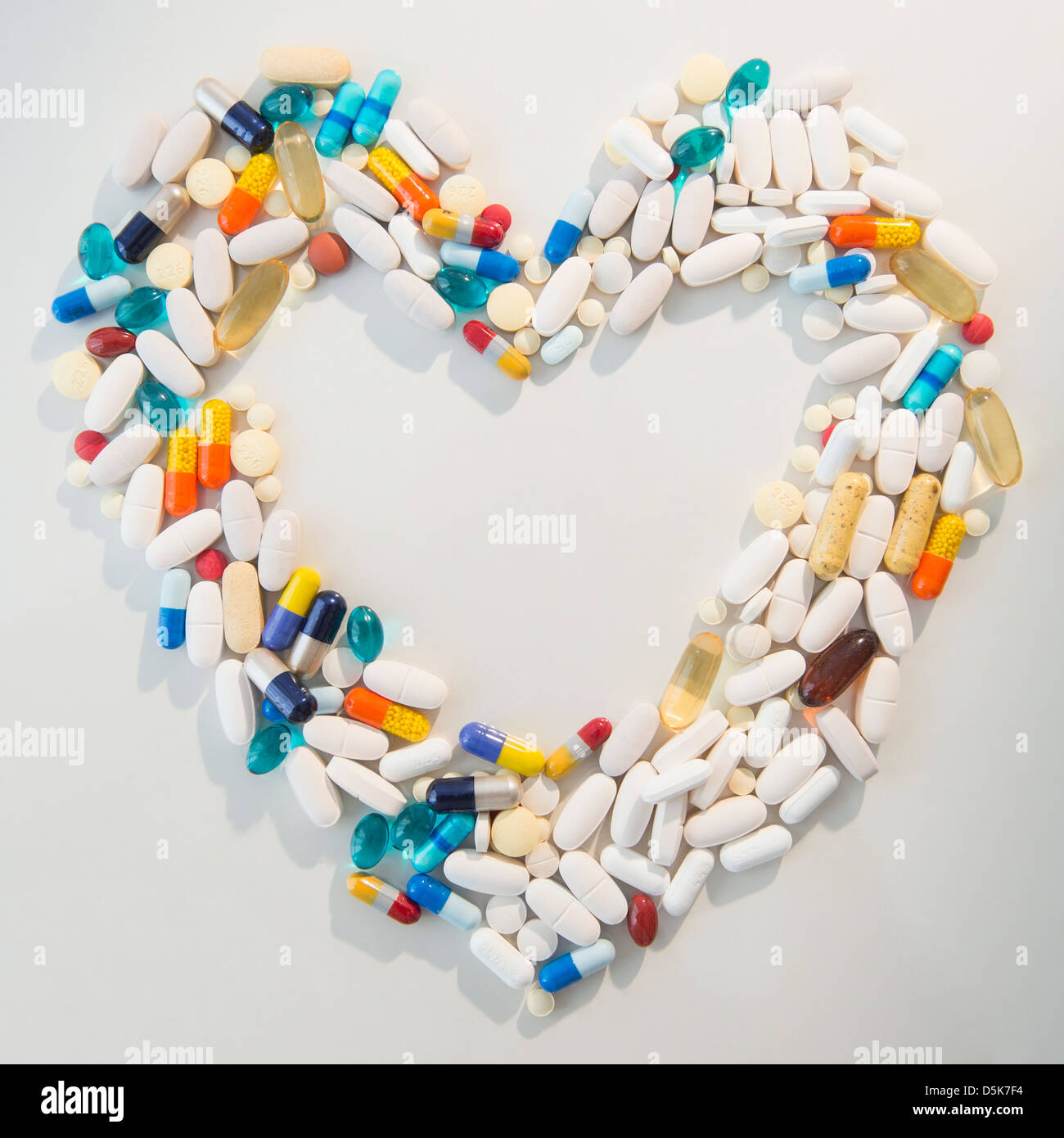 Studio shot of pills forming heart shape Stock Photo - Alamy