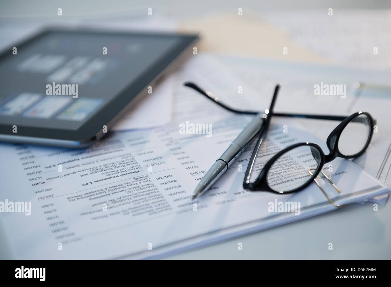 Still life with spectacles, bills and digital tablet Stock Photo - Alamy