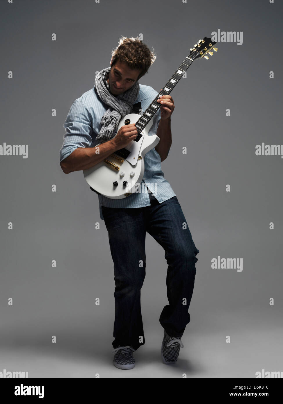 Man playing electric guitar hi-res stock photography and images - Alamy