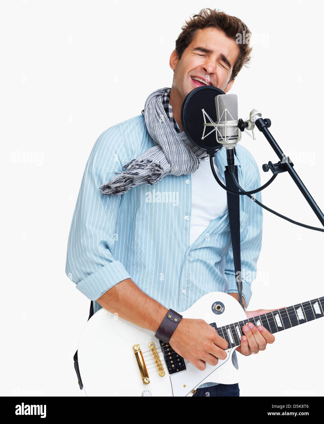 Studio shot of man singing Stock Photo - Alamy