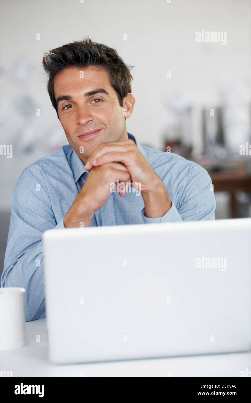 Portrait of man with laptop Stock Photo - Alamy