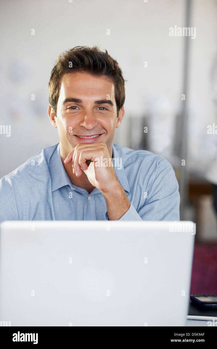 Portrait of man with laptop Stock Photo - Alamy