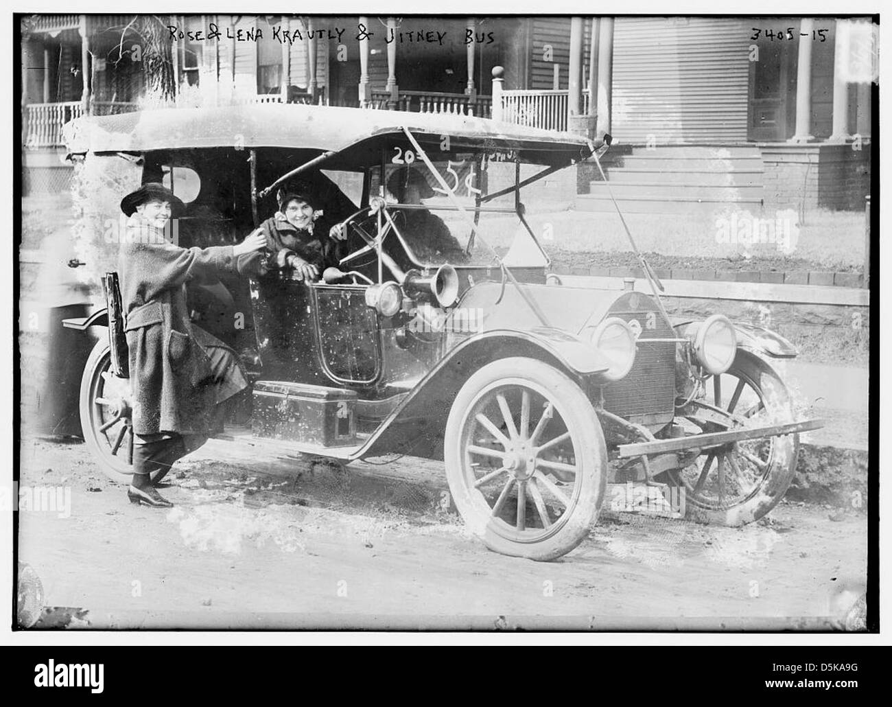 Rose and Lena Krautly are photographed with a jitney bus, which was a ...