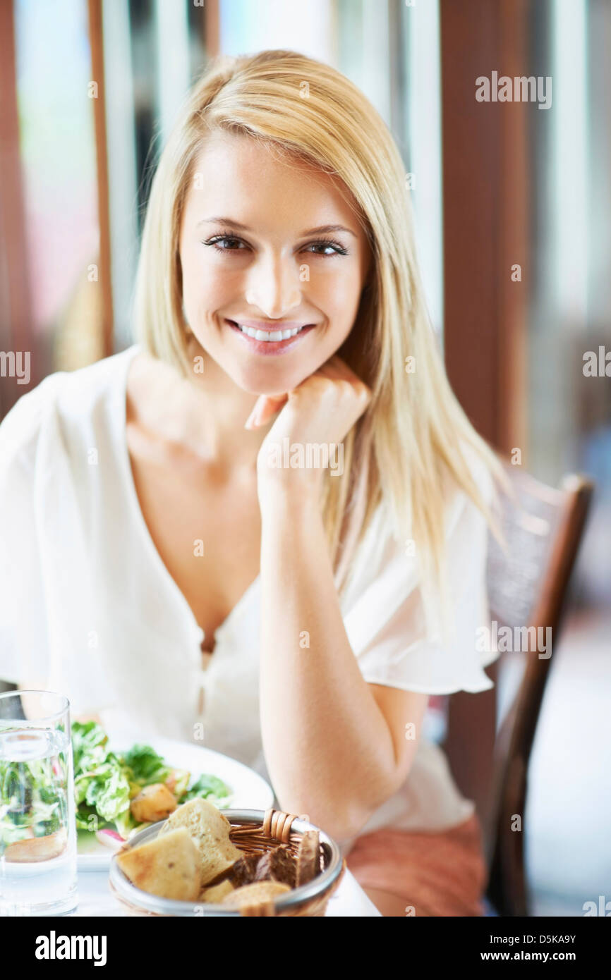Woman eating lunch Stock Photo - Alamy