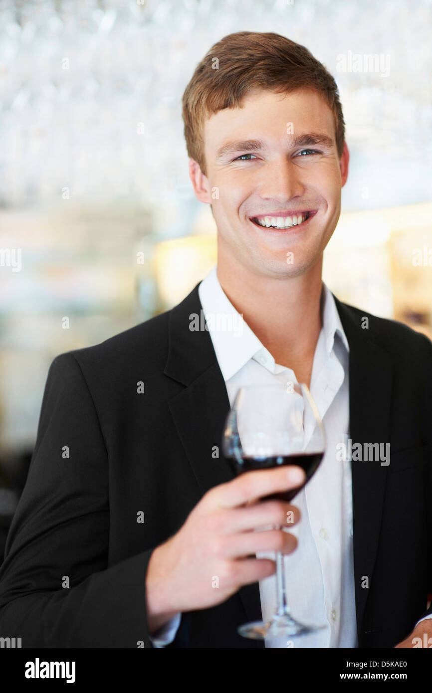 Portrait of man drinking wine Stock Photo - Alamy