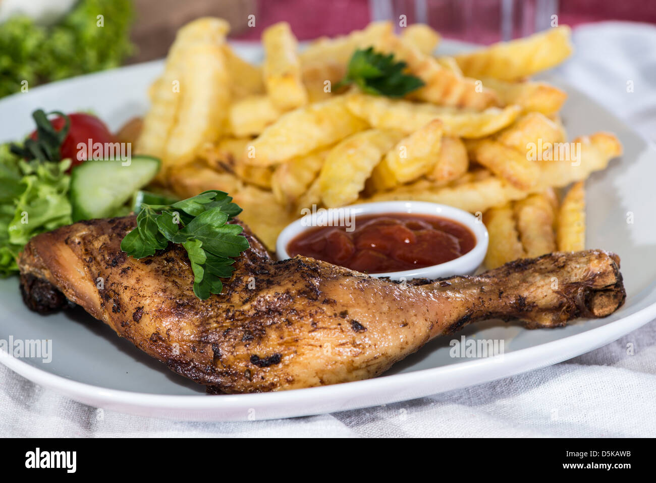 Grilled Chicken Legs with Chips and Sauce Stock Photo - Alamy