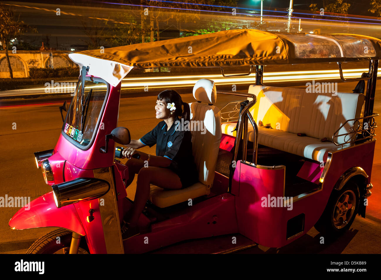 Thai Girl driving a Pink Tuk Tuk Stock Photo - Alamy