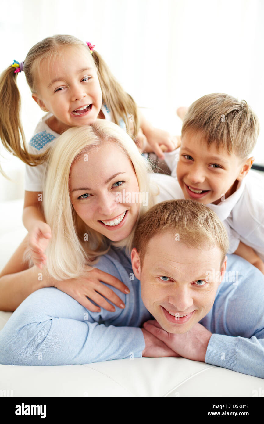 Portrait of happy family laughing Stock Photo - Alamy