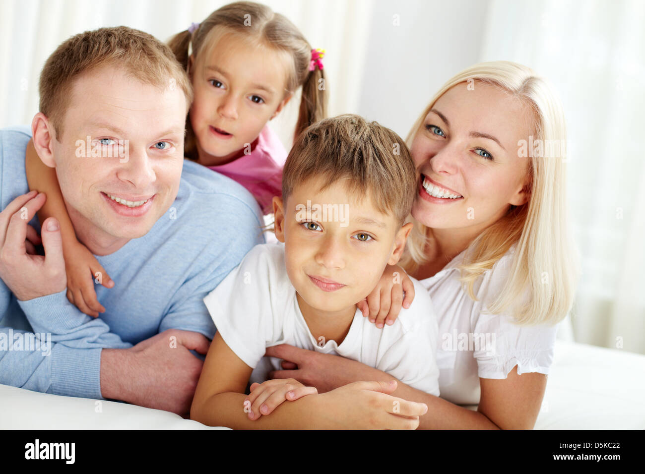 Portrait of happy family resting at home Stock Photo - Alamy