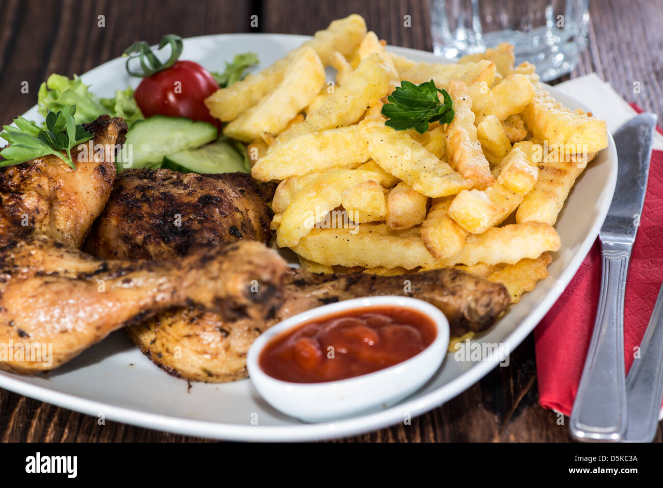 Grilled Chicken Legs with Chips and Sauce Stock Photo - Alamy