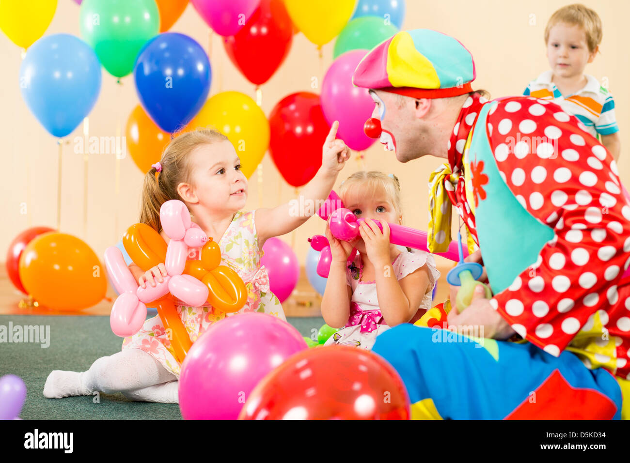 happy children and clown on birthday party Stock Photo - Alamy