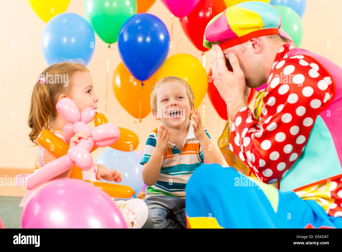 happy children and clown on birthday party Stock Photo - Alamy