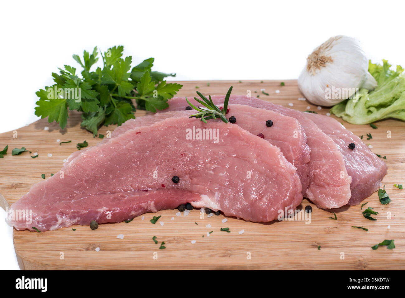 Raw Schnitzel on a Board (isolated on white Stock Photo - Alamy