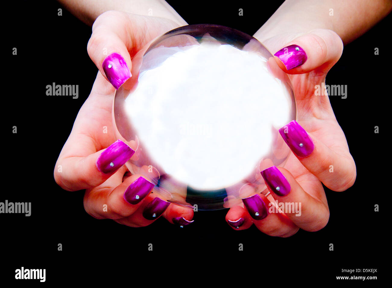 Orb with two hands on black background Stock Photo - Alamy