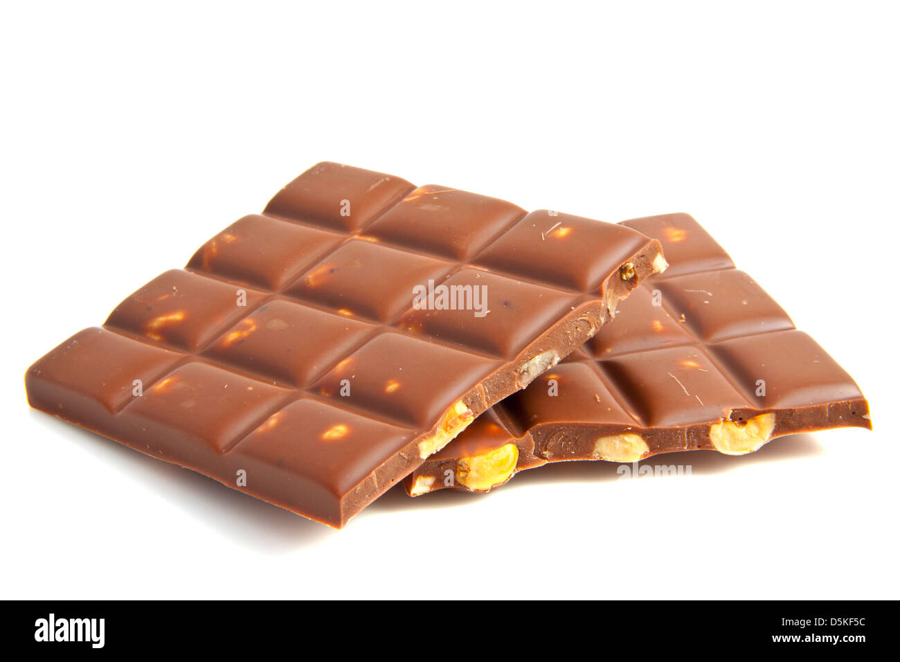 Chocolate bar with hazel nuts isolated over white Stock Photo - Alamy
