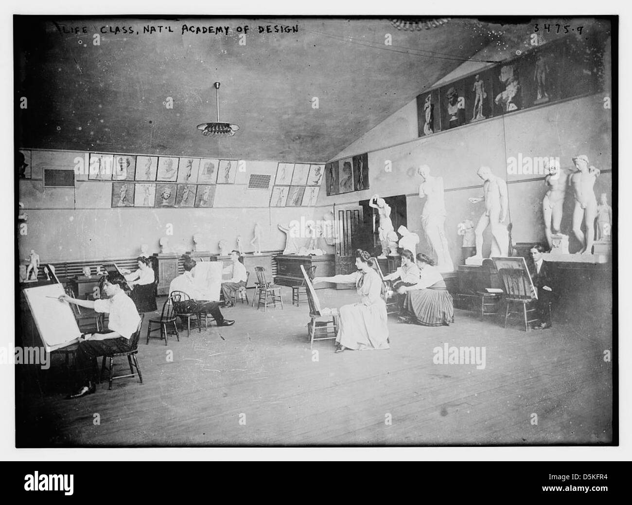 This photograph shows a life class at the National Academy of Design ...