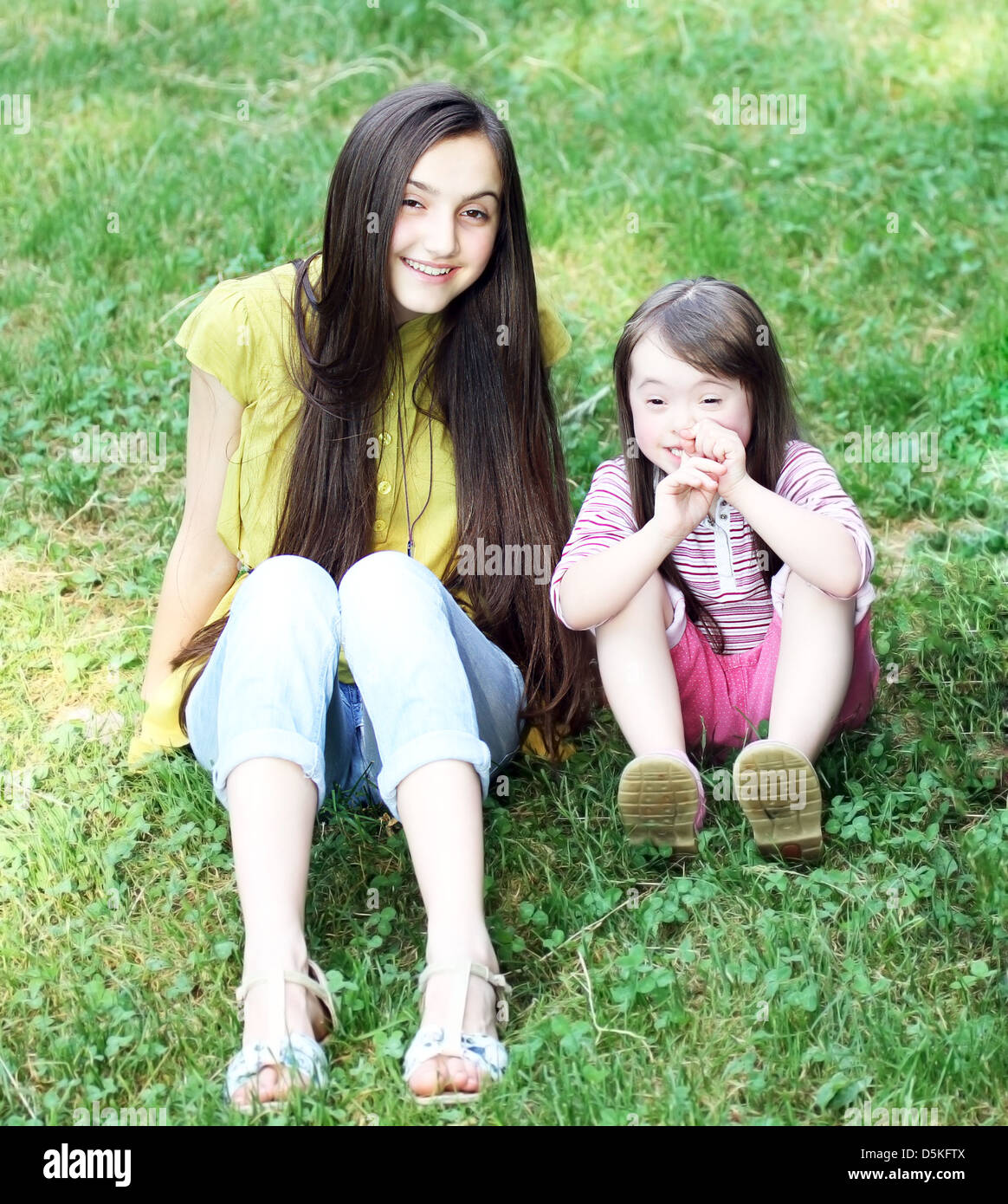 Happy girls in the park Stock Photo - Alamy